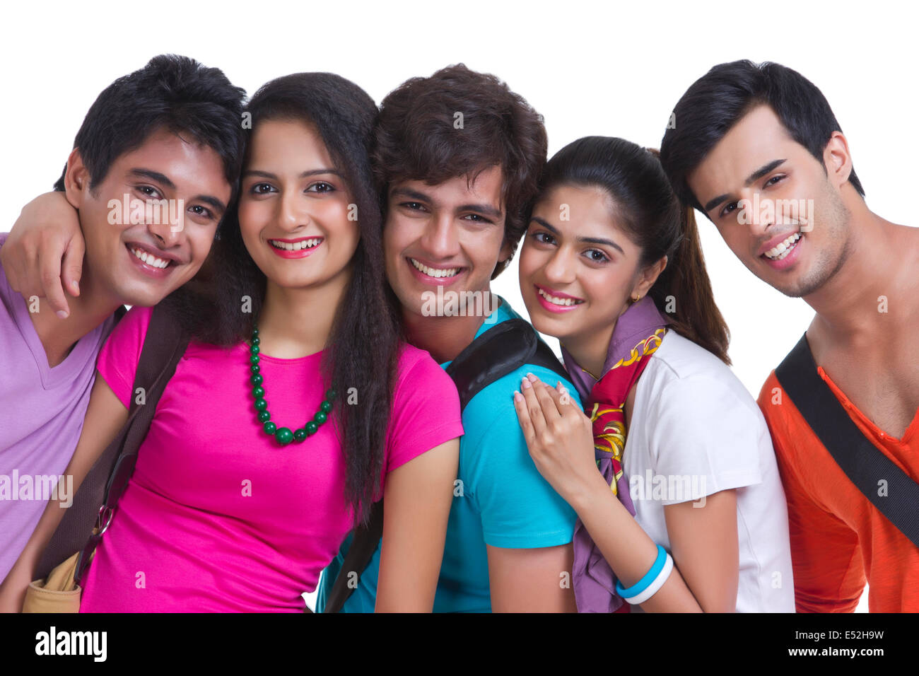 Portrait of university friends smiling together over white background ...