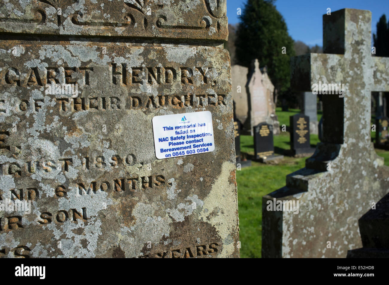 Memorial safety inspection notice on gravestones in a graveyard Stock ...