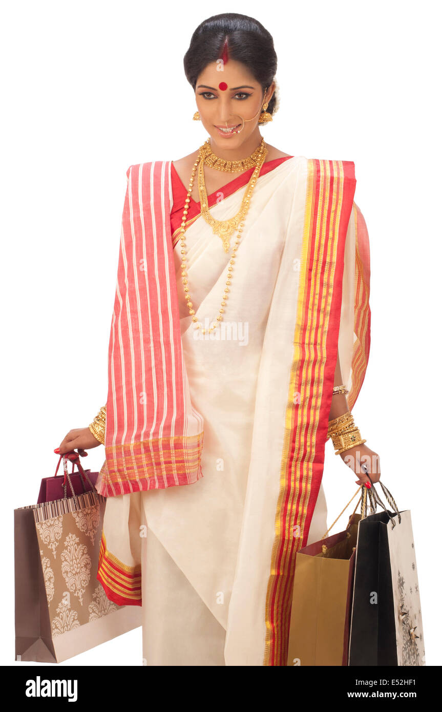 Bengali woman carrying shopping bags Stock Photo - Alamy