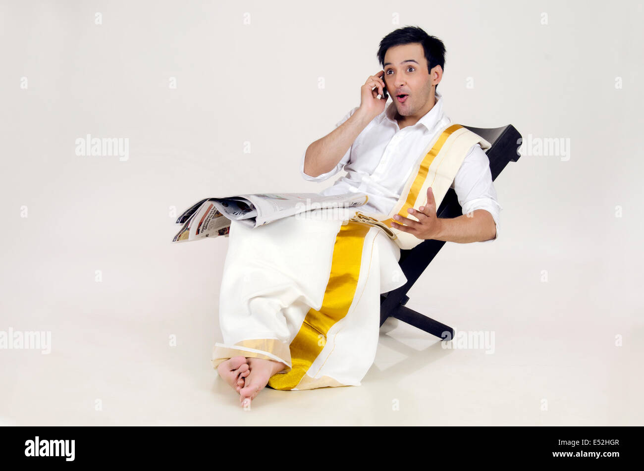 South Indian man talking on a mobile phone Stock Photo - Alamy