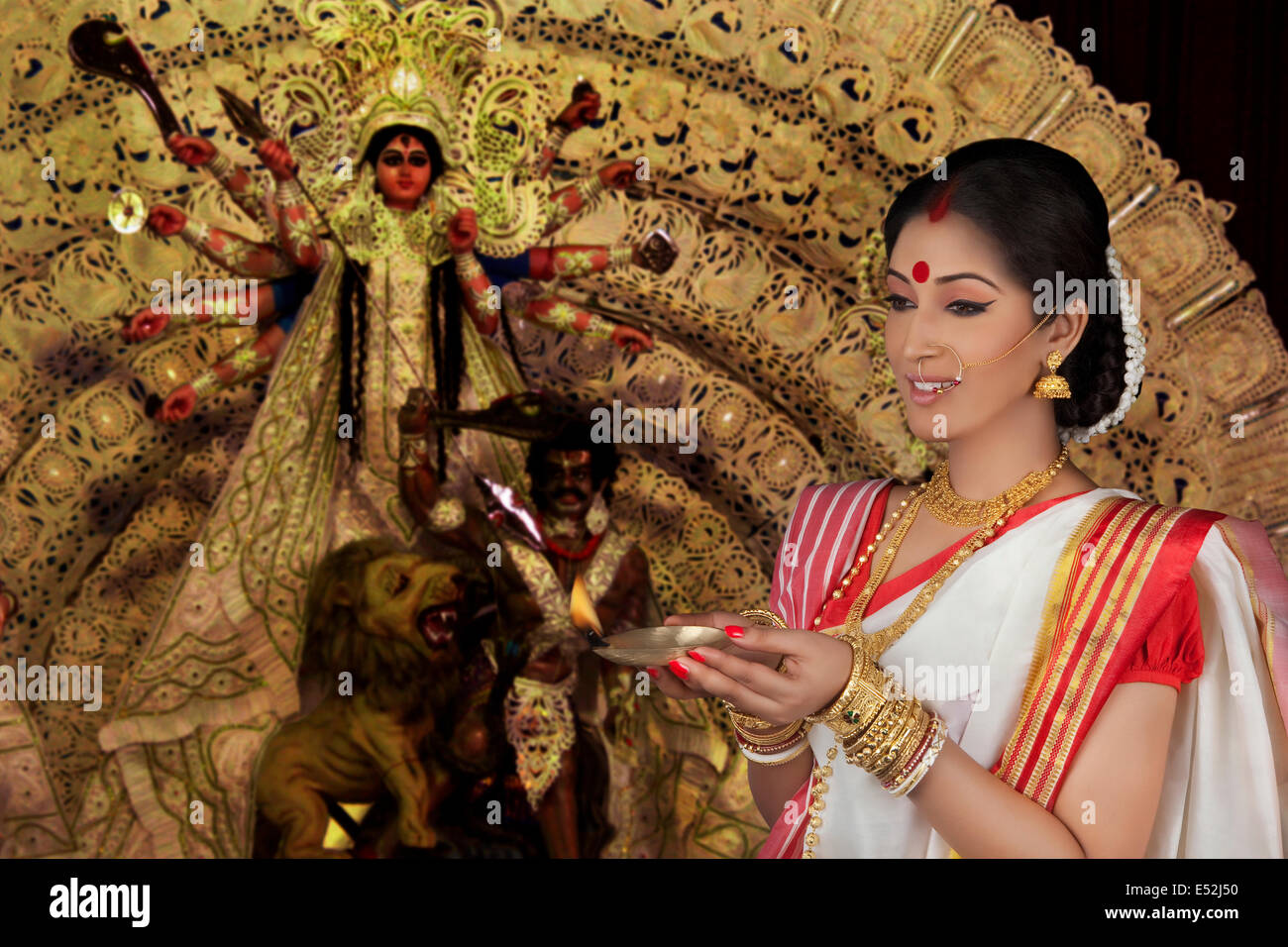 Indian female with diya hi-res stock photography and images - Alamy