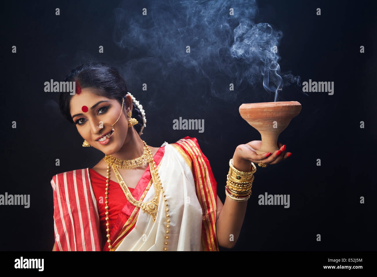 Portrait bengali woman holding dhunuchi hi-res stock photography and ...