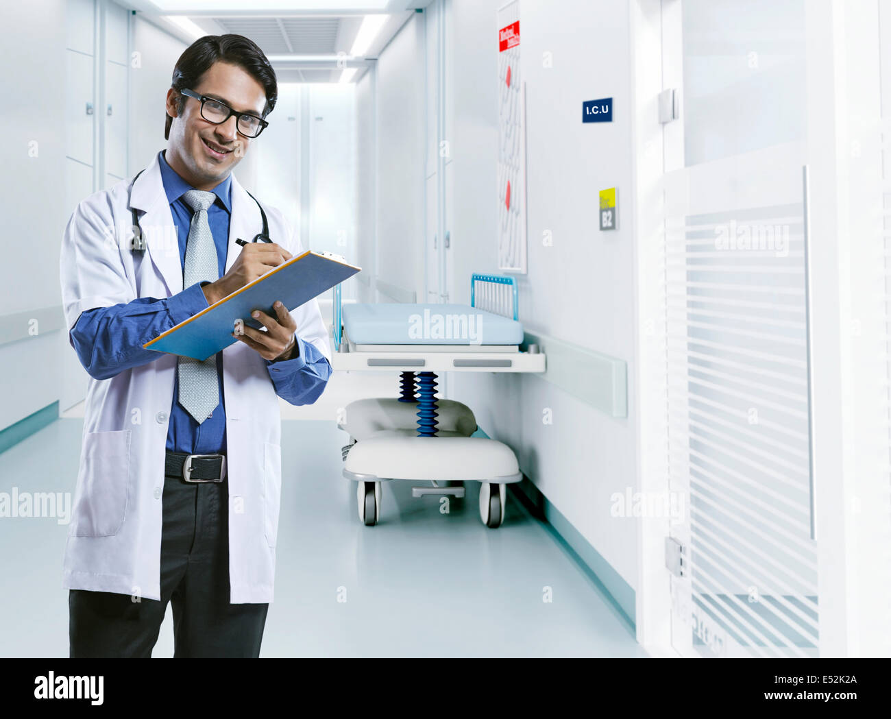Indian male doctor writing hi-res stock photography and images - Alamy