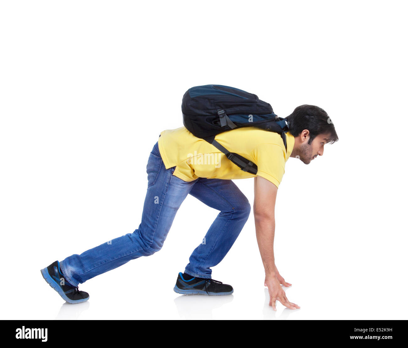 Young man at starting position of race Stock Photo - Alamy