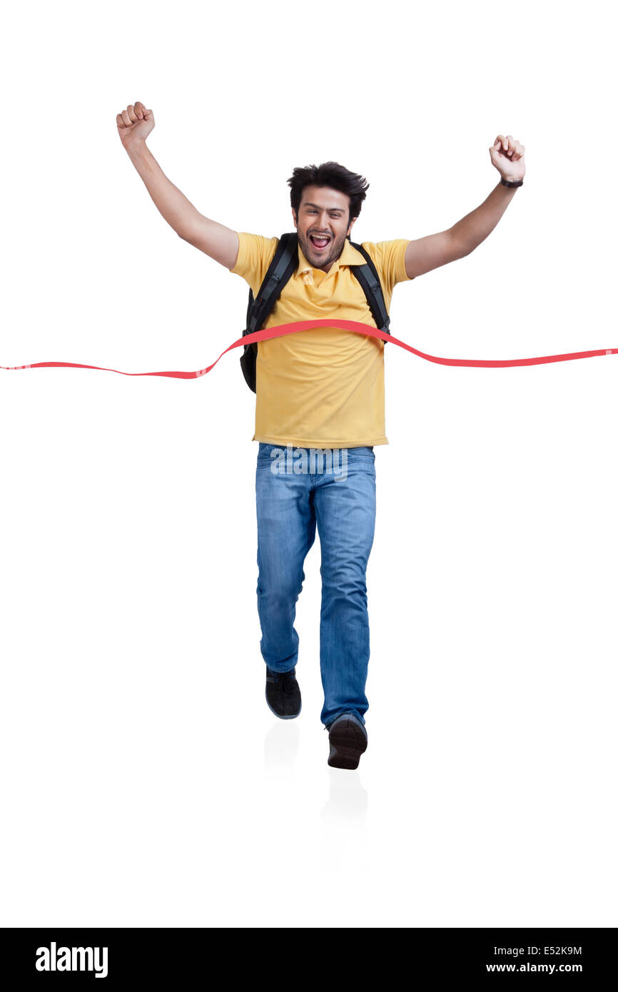 Young man at finishing line of race Stock Photo - Alamy