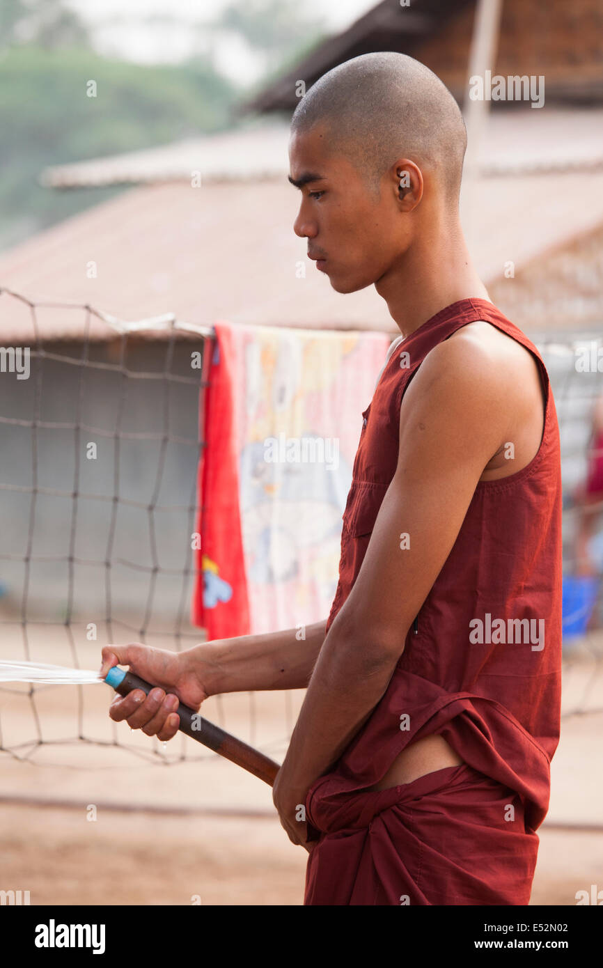 Young monks help clean the grounds of their small Bagan monastery ...