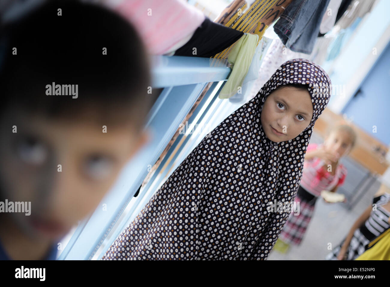 Gaza. 17th July, 2014. A Palestinian girl, who fled from her house near ...