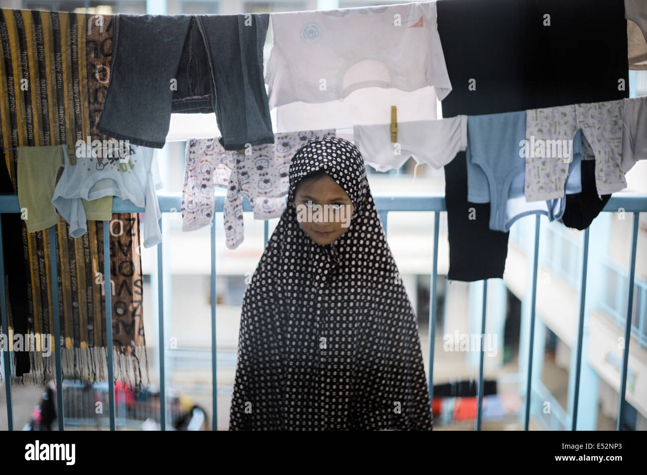 Gaza. 17th July, 2014. A Palestinian girl, who fled from her house near ...