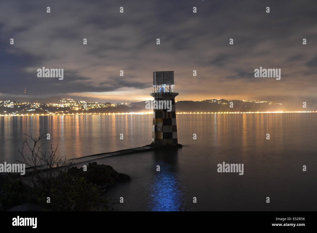 Lighthouse harbour night reflection hi-res stock photography and images ...