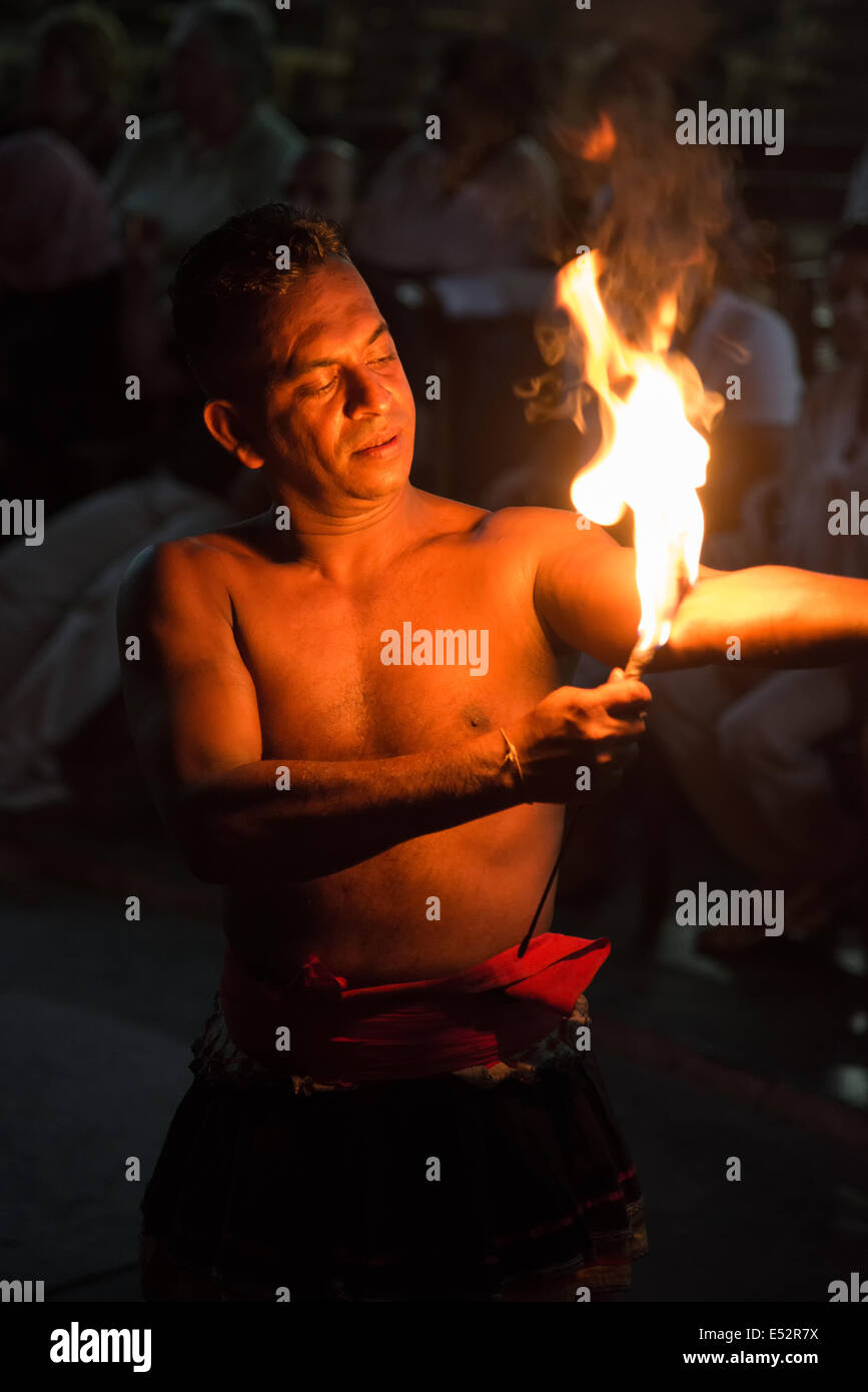 Sri Lankan artist performing a body burning during a fire show in Kandy ...