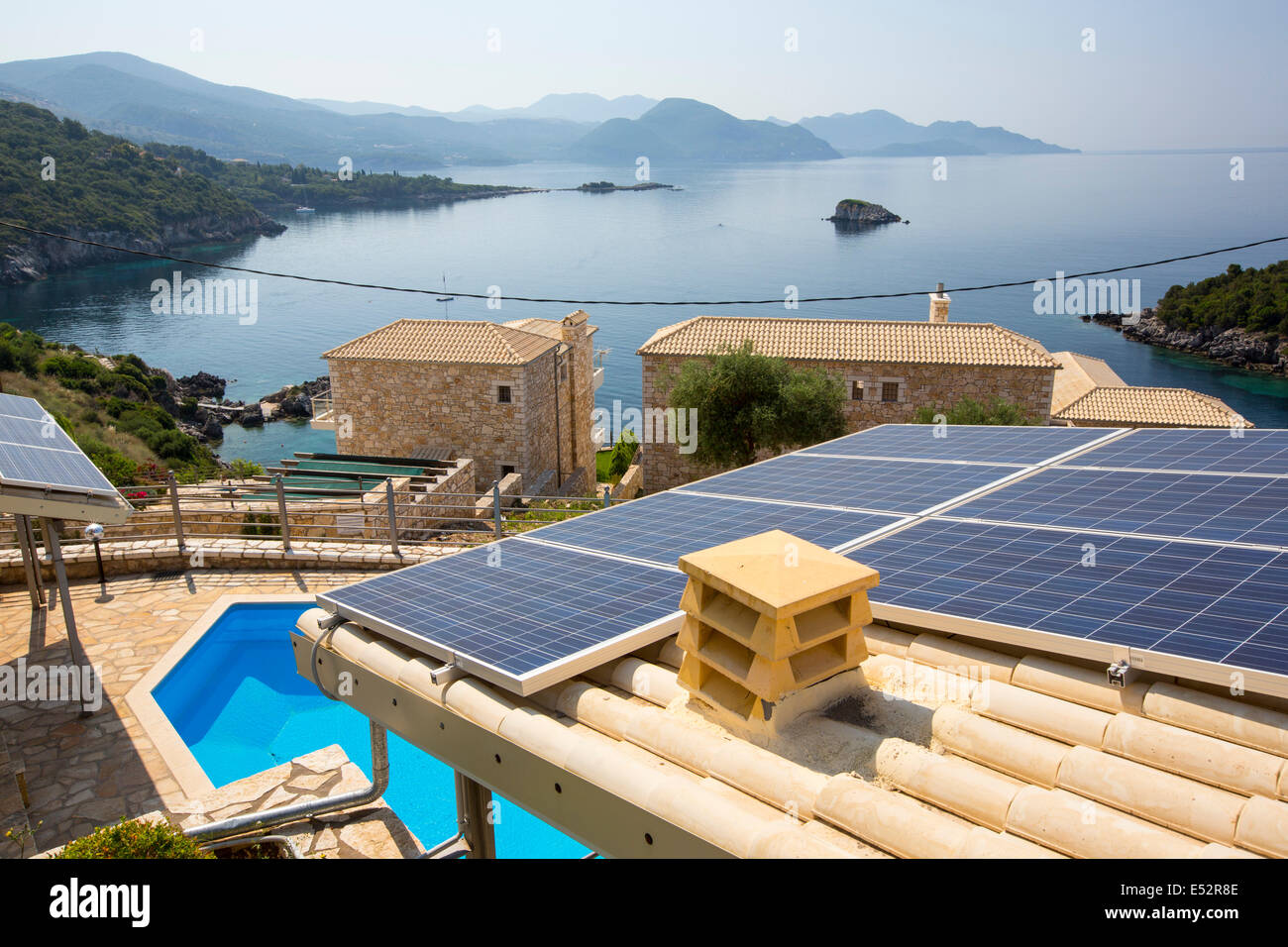 Solar panels on a house roof in Sivota, Greece Stock Photo - Alamy