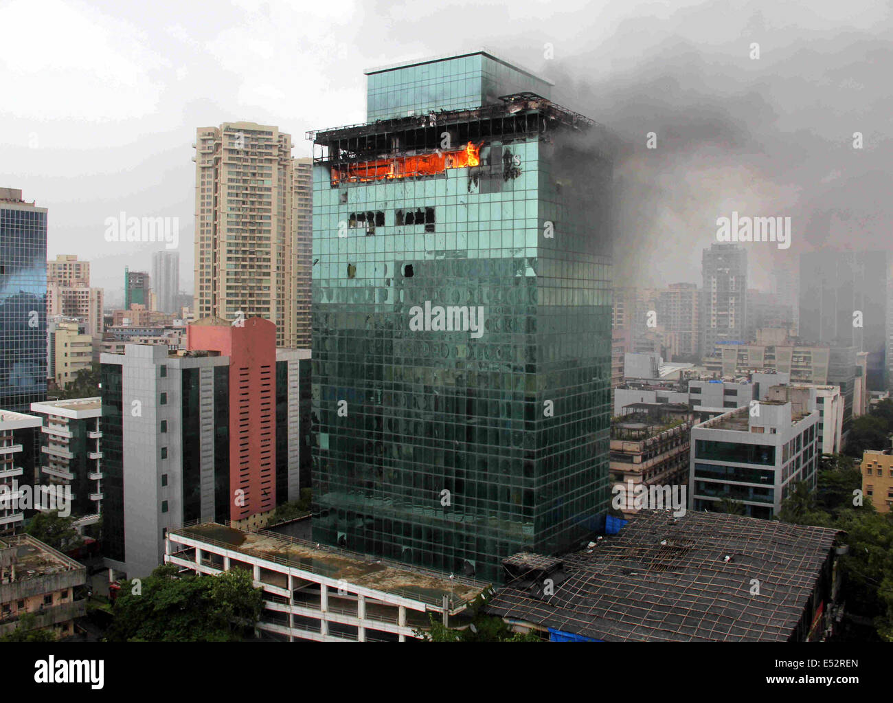 Mumbai. 18th July, 2014. Photo taken on July 18, 2014 shows a fire on ...
