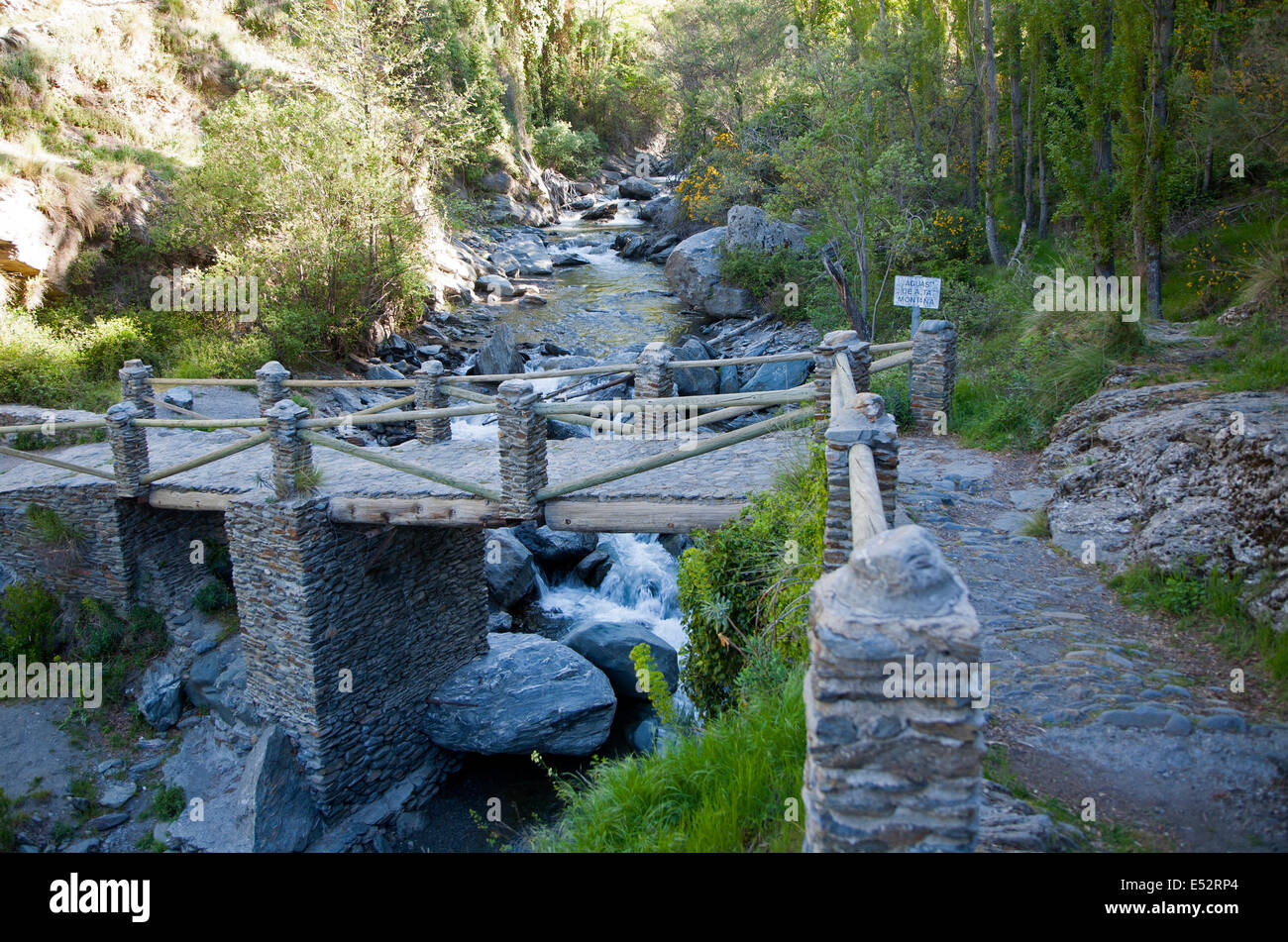 Bridge crossing the river rio poqueira gorge valley hi-res stock ...