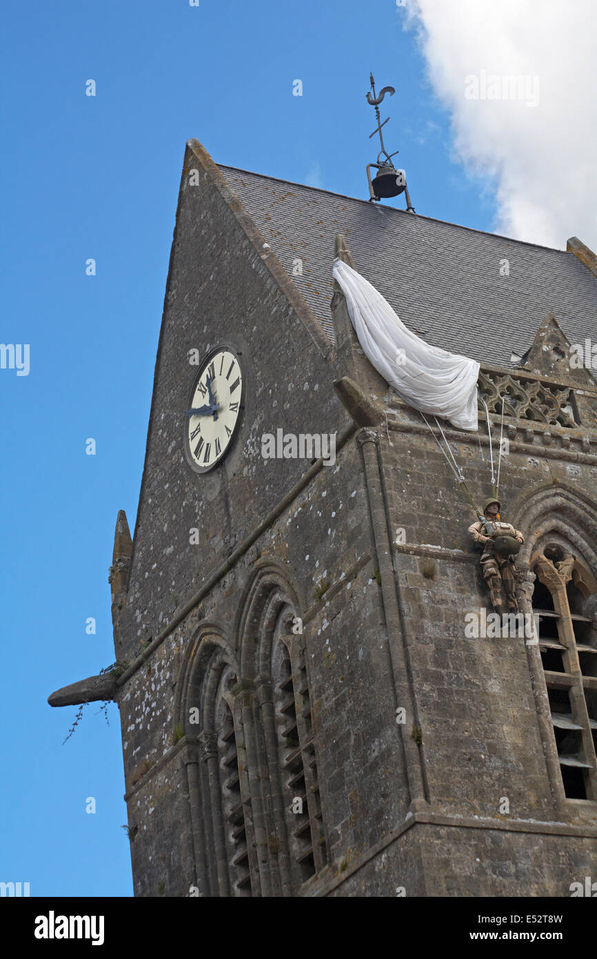 dummy paratrooper hangs from the church spire, commemorating the story ...