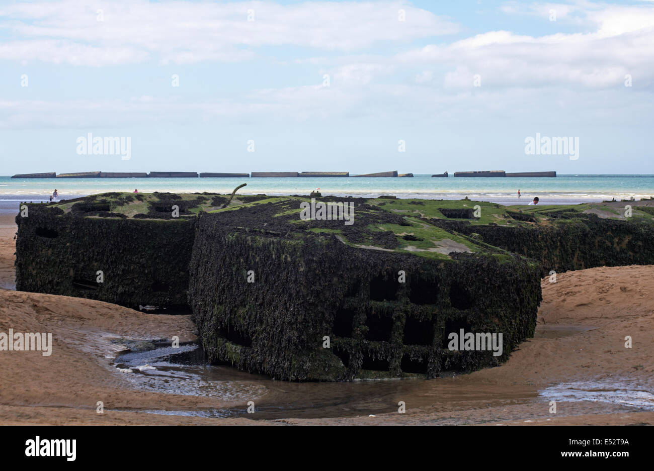 remnants of Mulberry Harbour on the beach at Arromanches Normandy ...