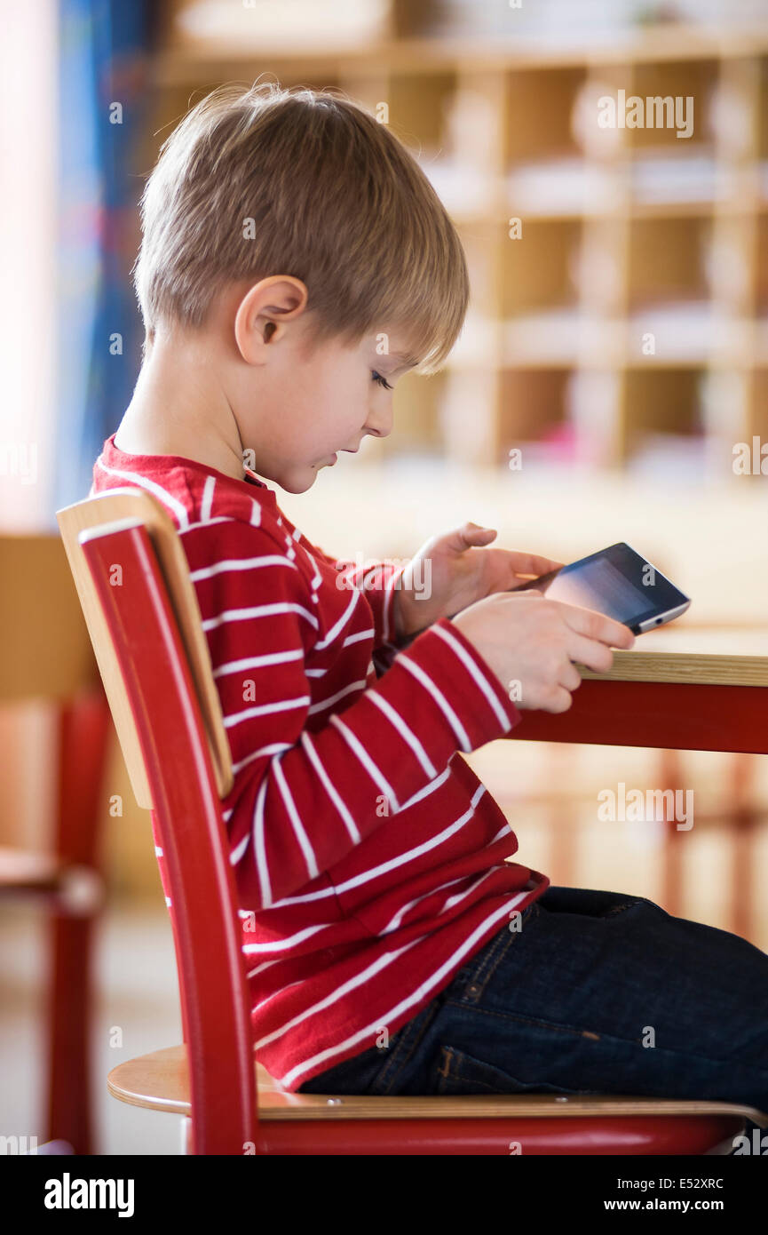 school boy in the classroom with iPad Stock Photo - Alamy