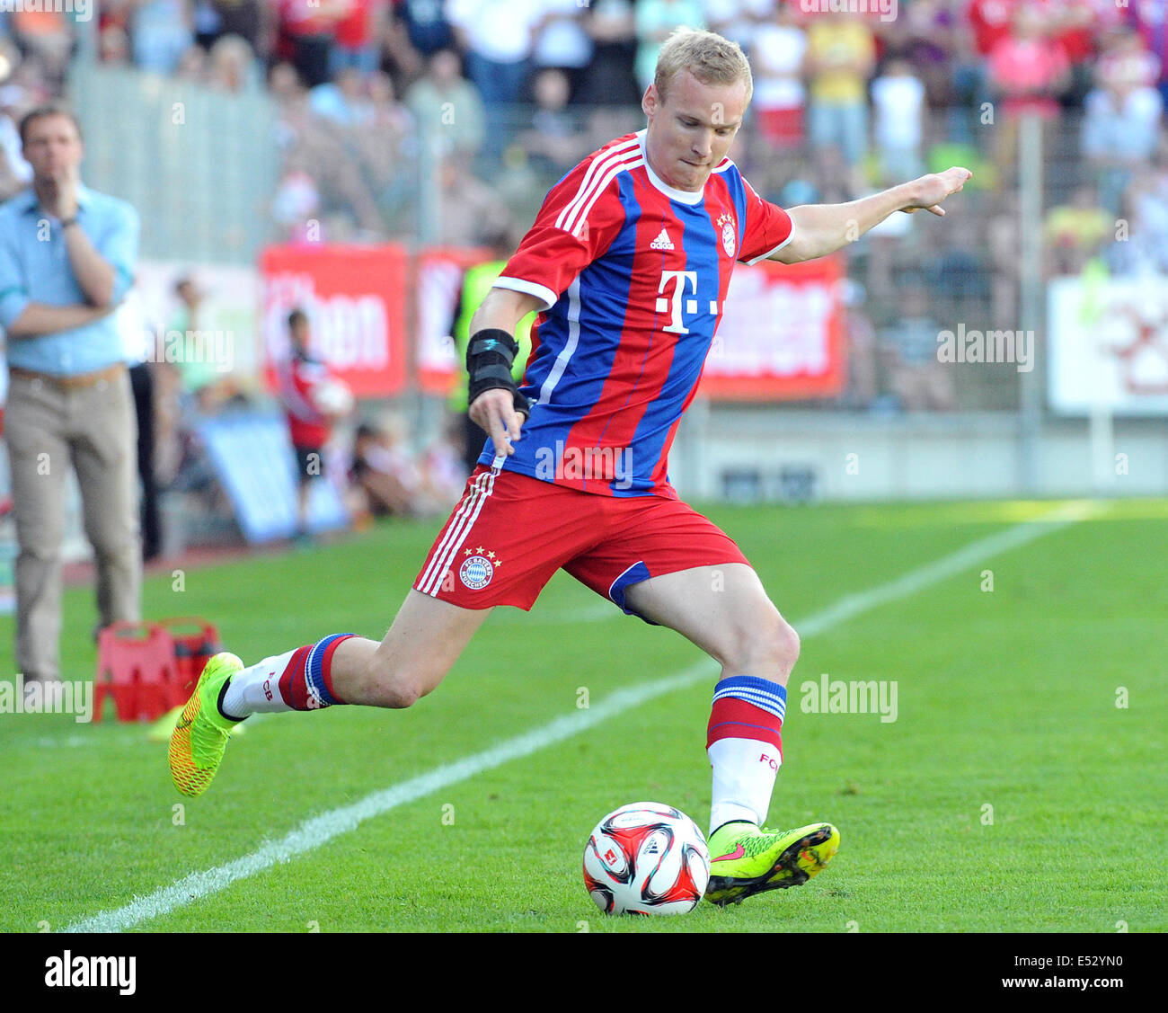 Memmingen, Germany. 18th July, 2014. Munich's Sebastian Rode vies for ...