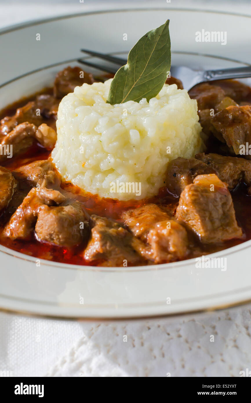 A Bulgarian-style pork stew with tomato sauce with red wine and white ...
