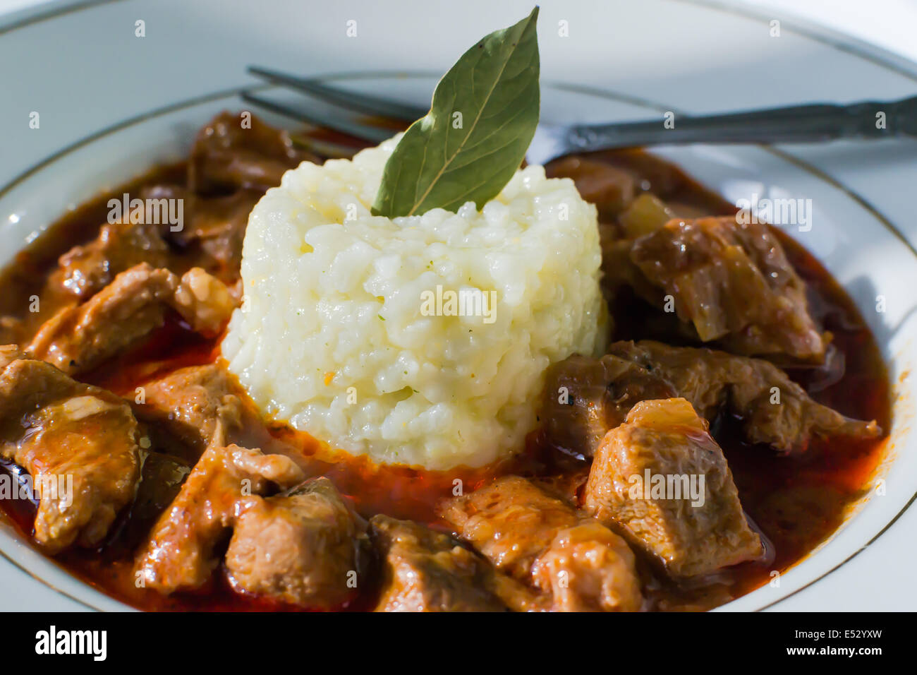 A Bulgarian-style pork stew with tomato sauce with red wine and white ...