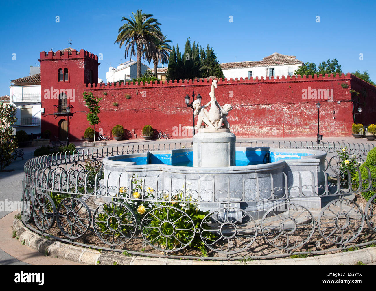 Moorish red castle walls in Plaza de la Constitucion, Alhama de Granada ...