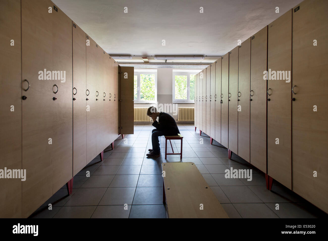 school locker room with sitting pupil Stock Photo - Alamy