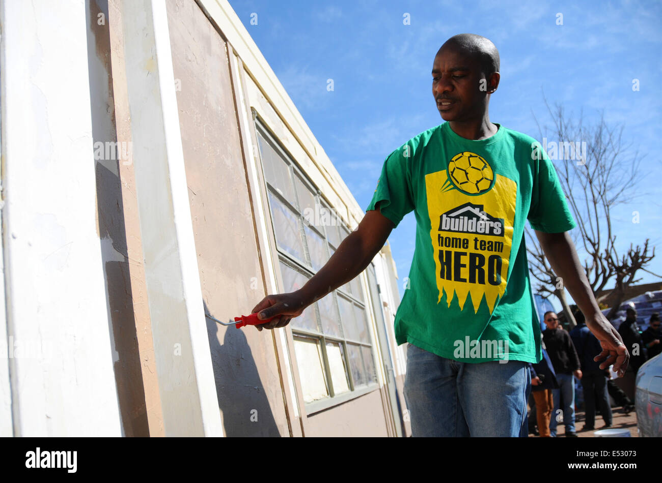 Johannesburg, South Africa. 18th July, 2014. A volunteer paints the ...