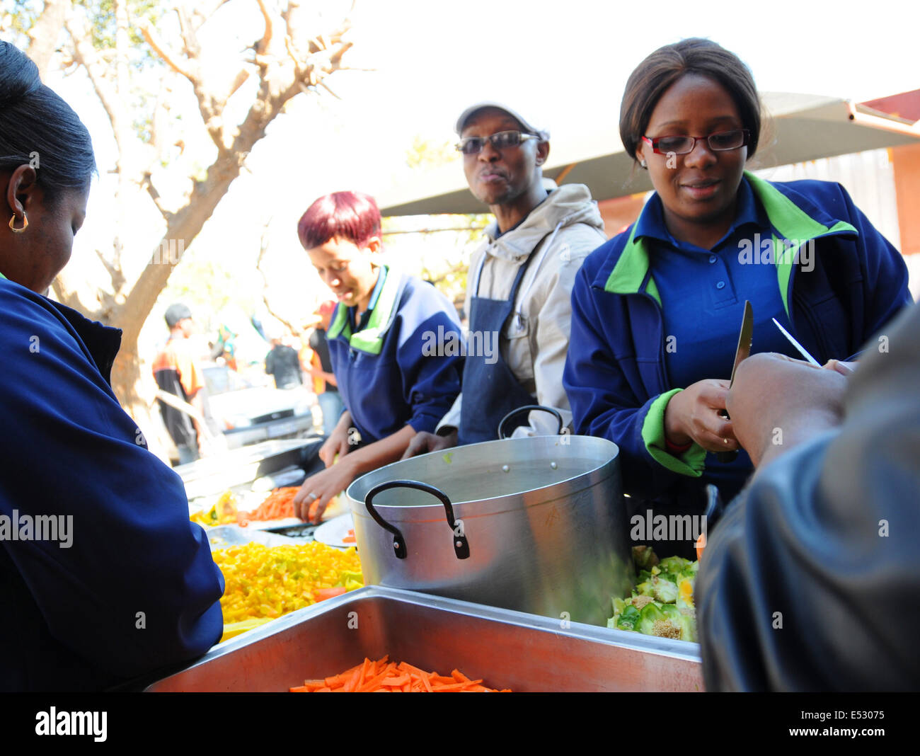 Johannesburg, South Africa. 18th July, 2014. Volunteers prepare food ...