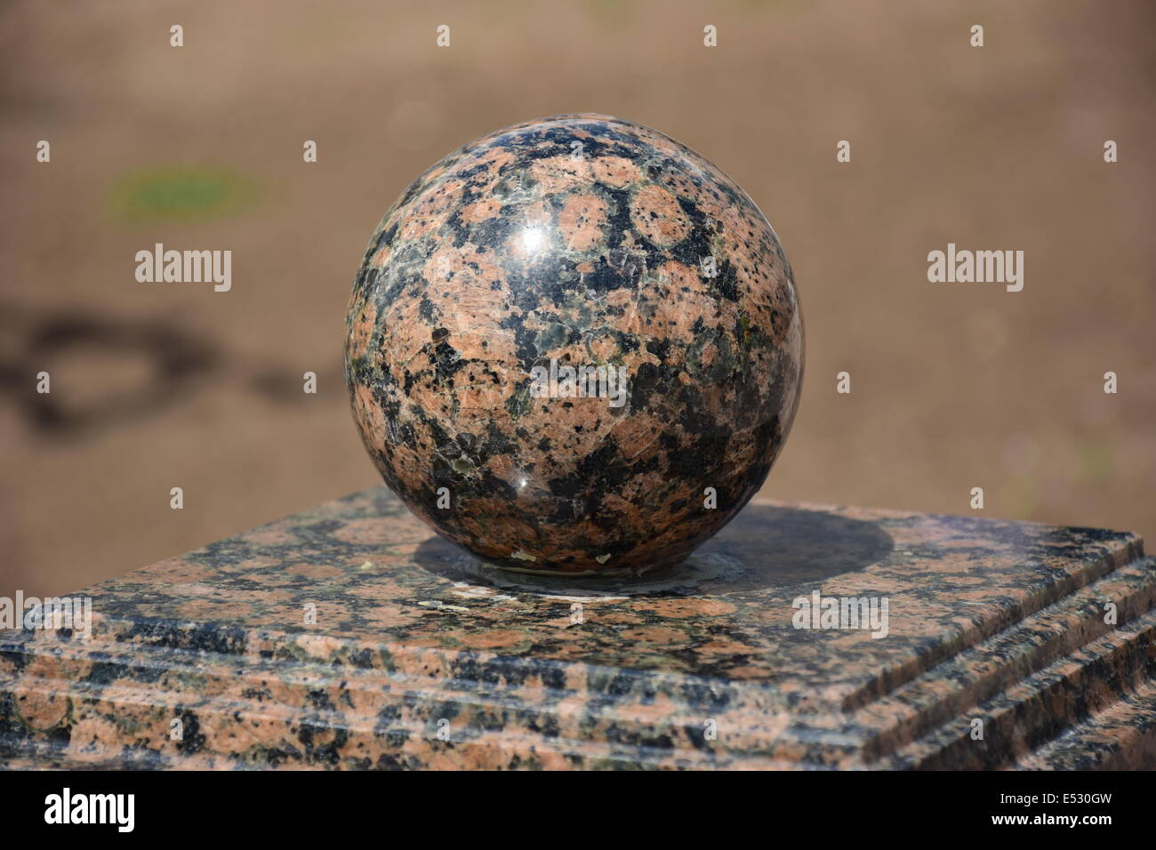 A small stone sphere as a decorative element Stock Photo - Alamy