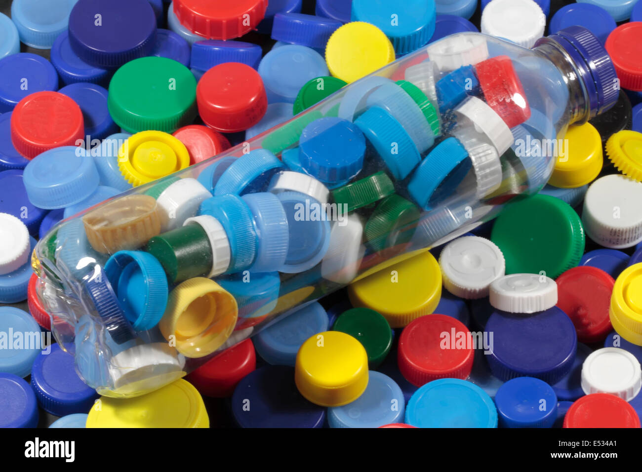 bottle and plastic colored caps Stock Photo - Alamy