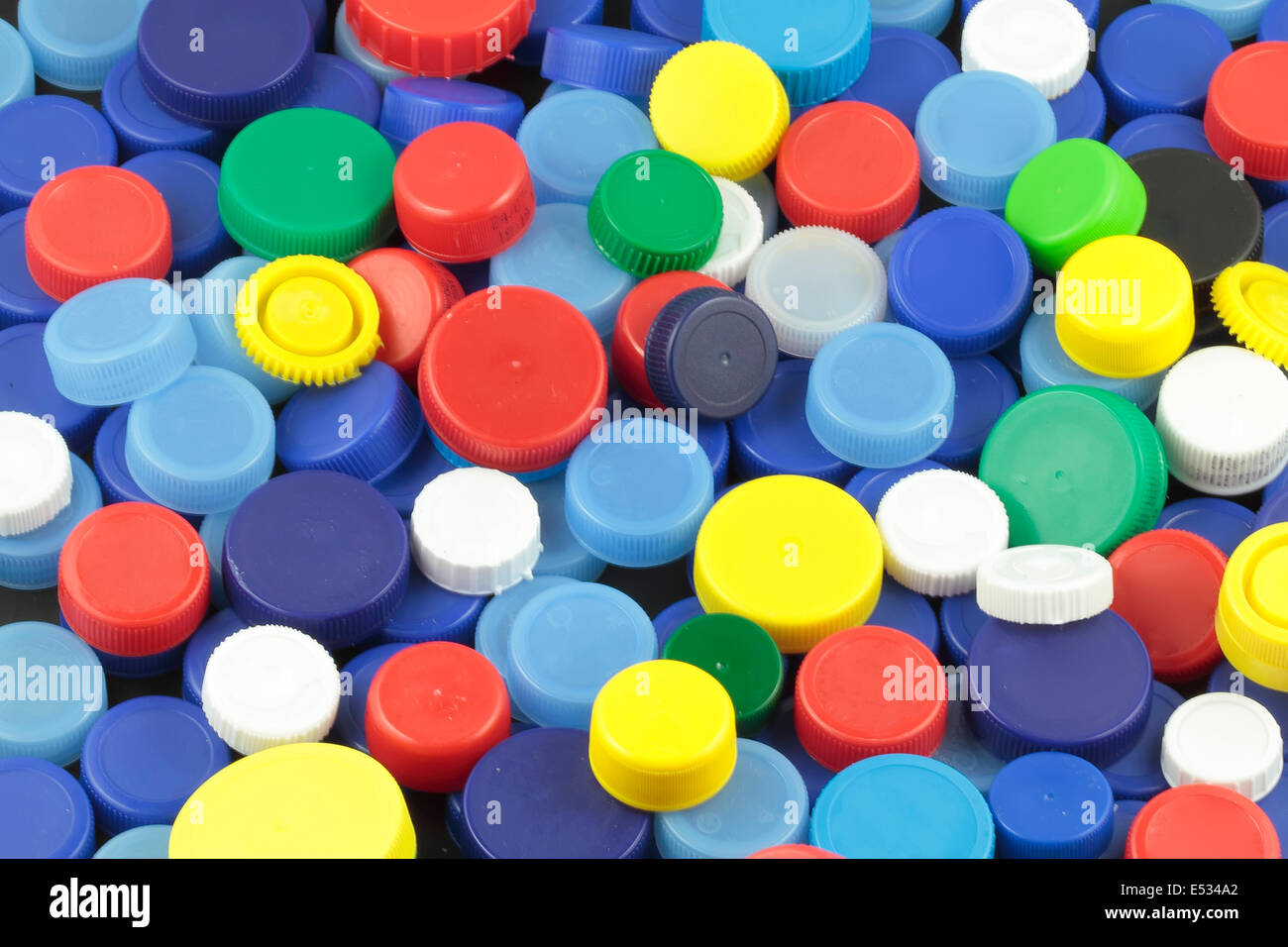 background of some plastic colored caps Stock Photo - Alamy