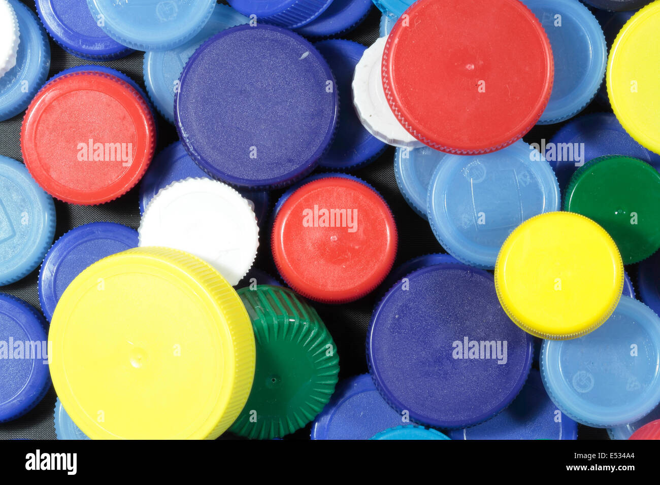 background of some plastic colored caps Stock Photo - Alamy