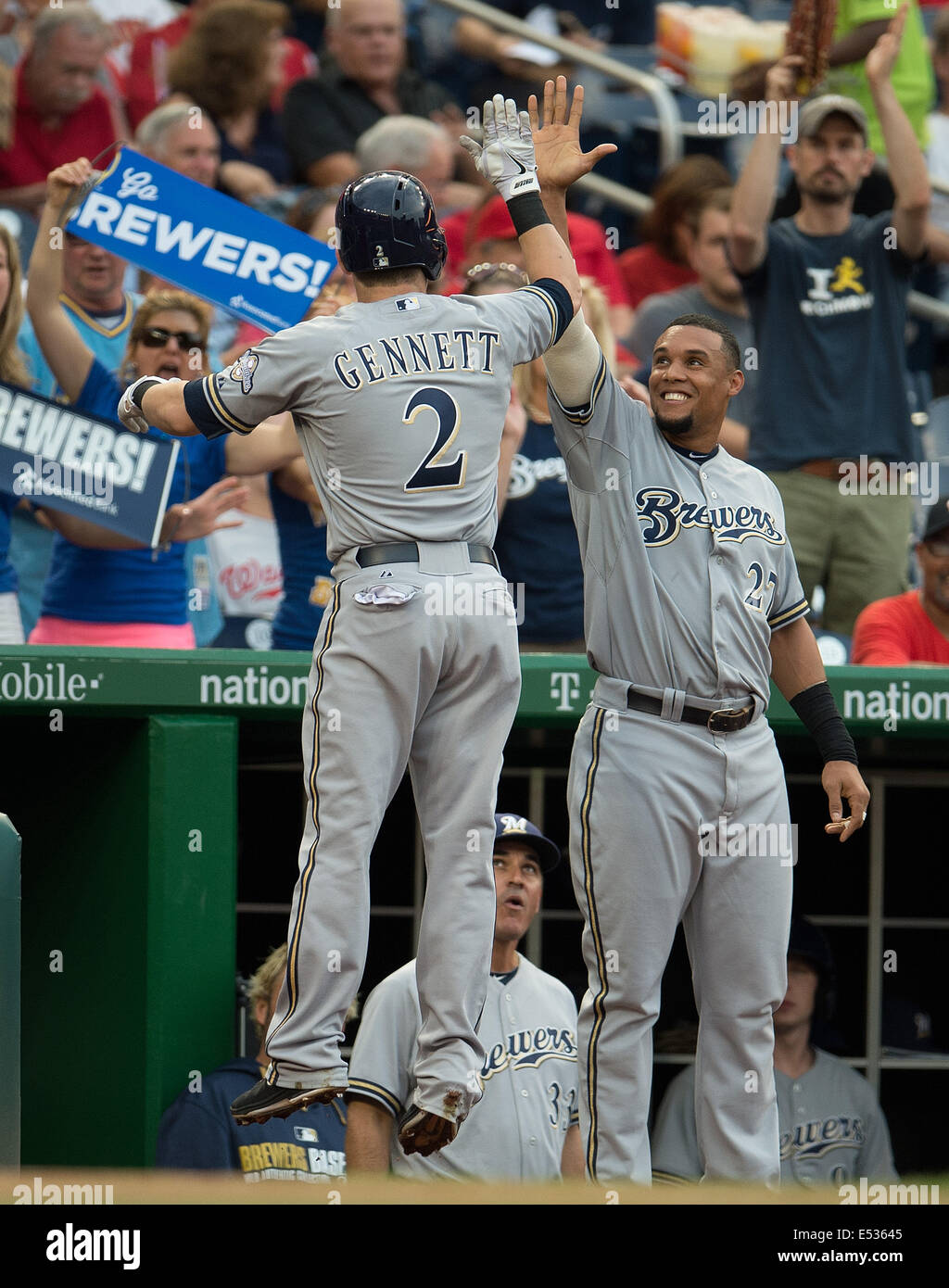 Milwaukee Brewers second baseman Scooter Gennett (2) jumps to high-five ...
