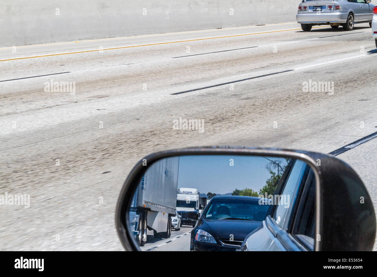 Traffic in the rear view mirror in Los Angeles on the 60 freeway Stock ...