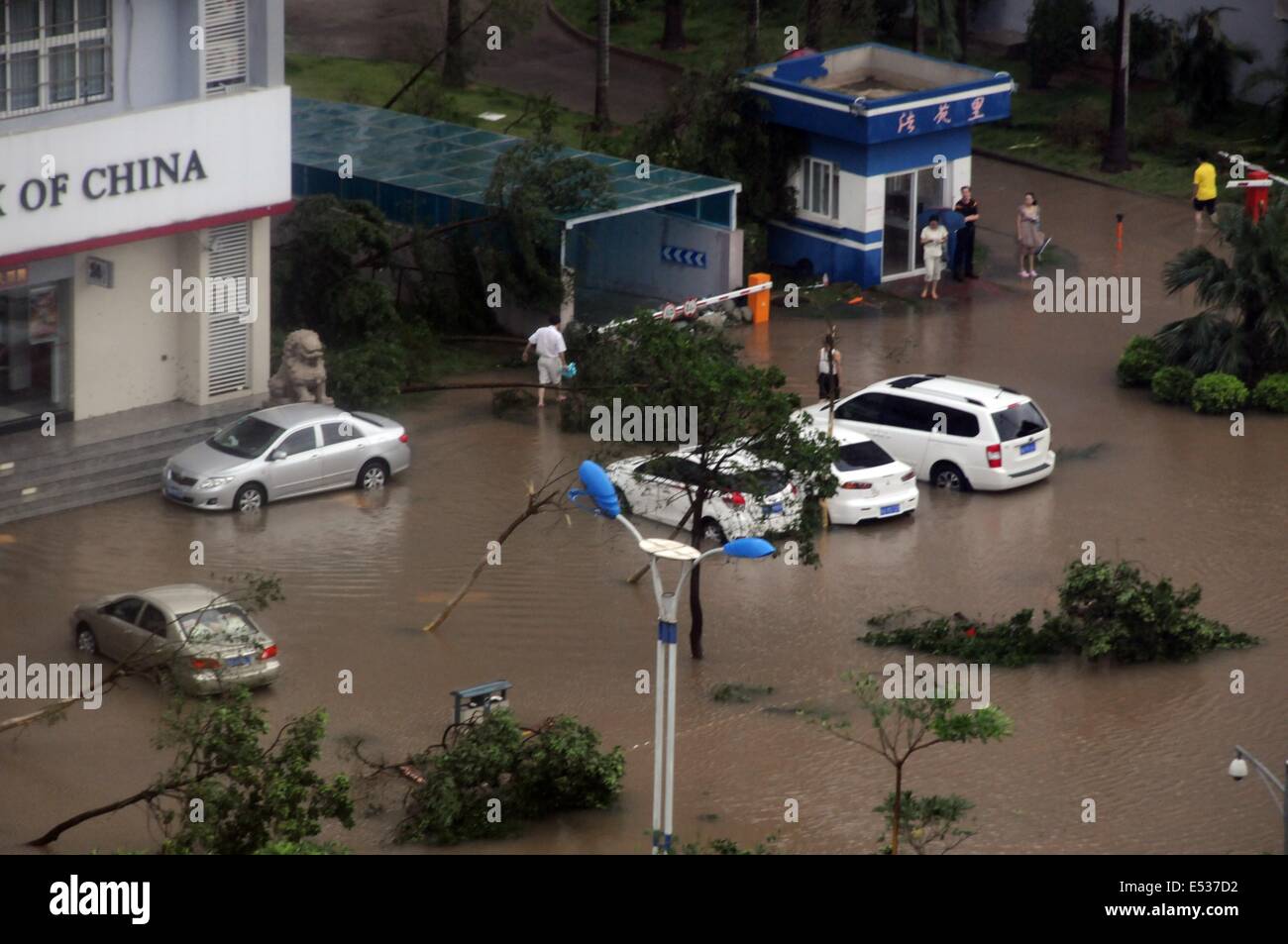Haikou, China's Hainan Province. 19th July, 2014. Motorcars are soaked ...