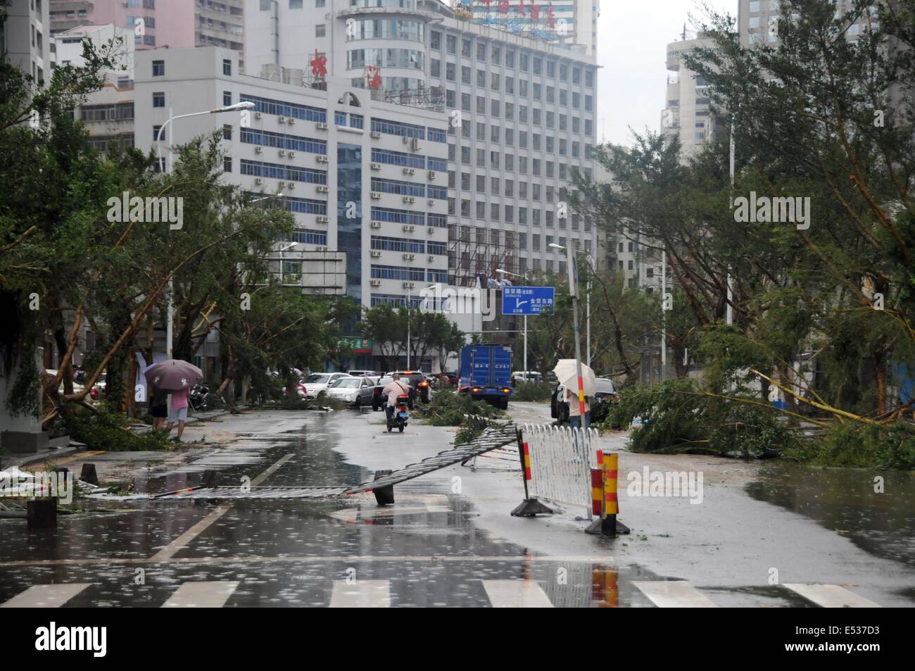 Haikou, China's Hainan Province. 19th July, 2014. Trees fall and ...