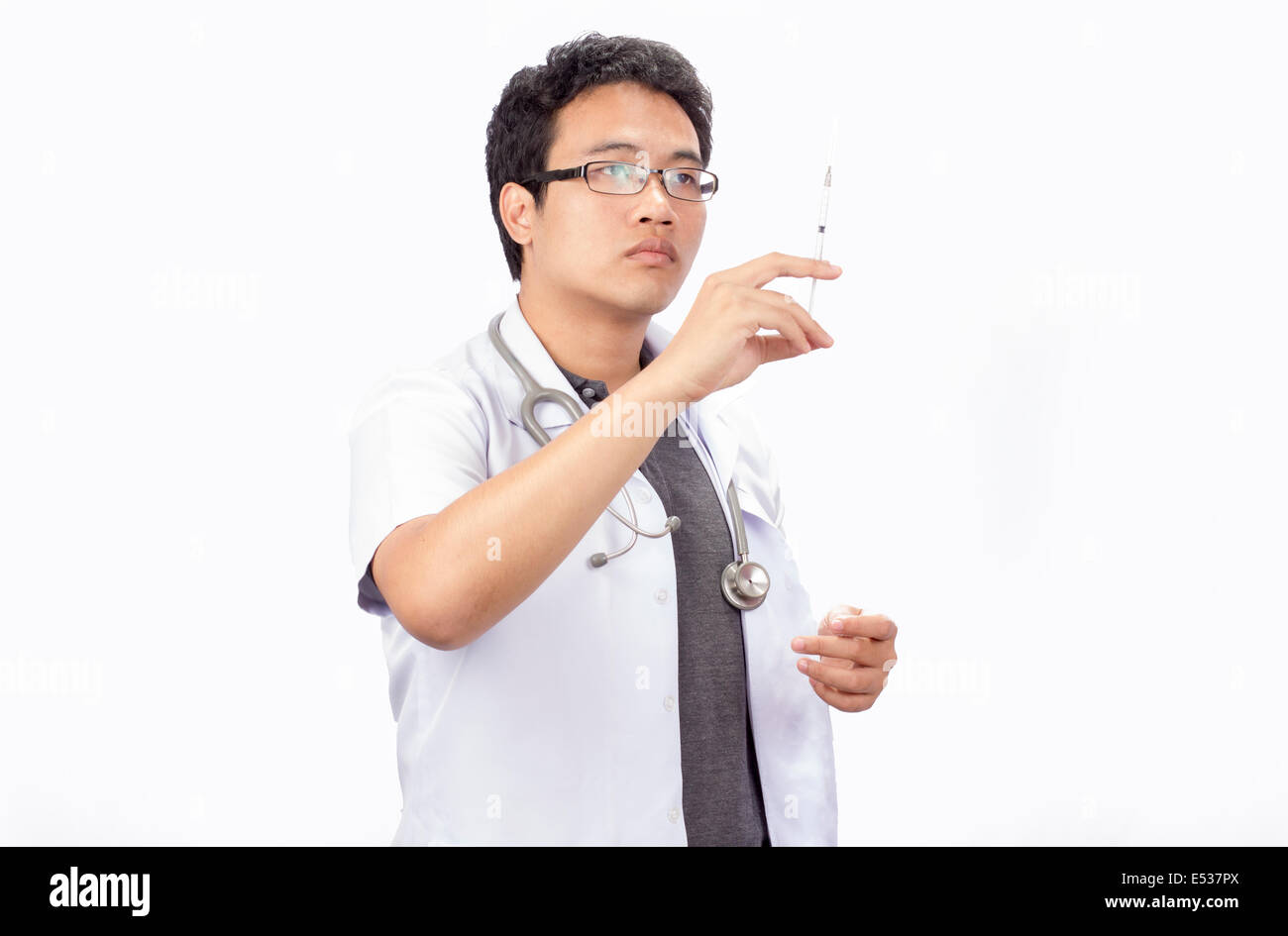 doctor preparing a syringe on a white background Stock Photo - Alamy