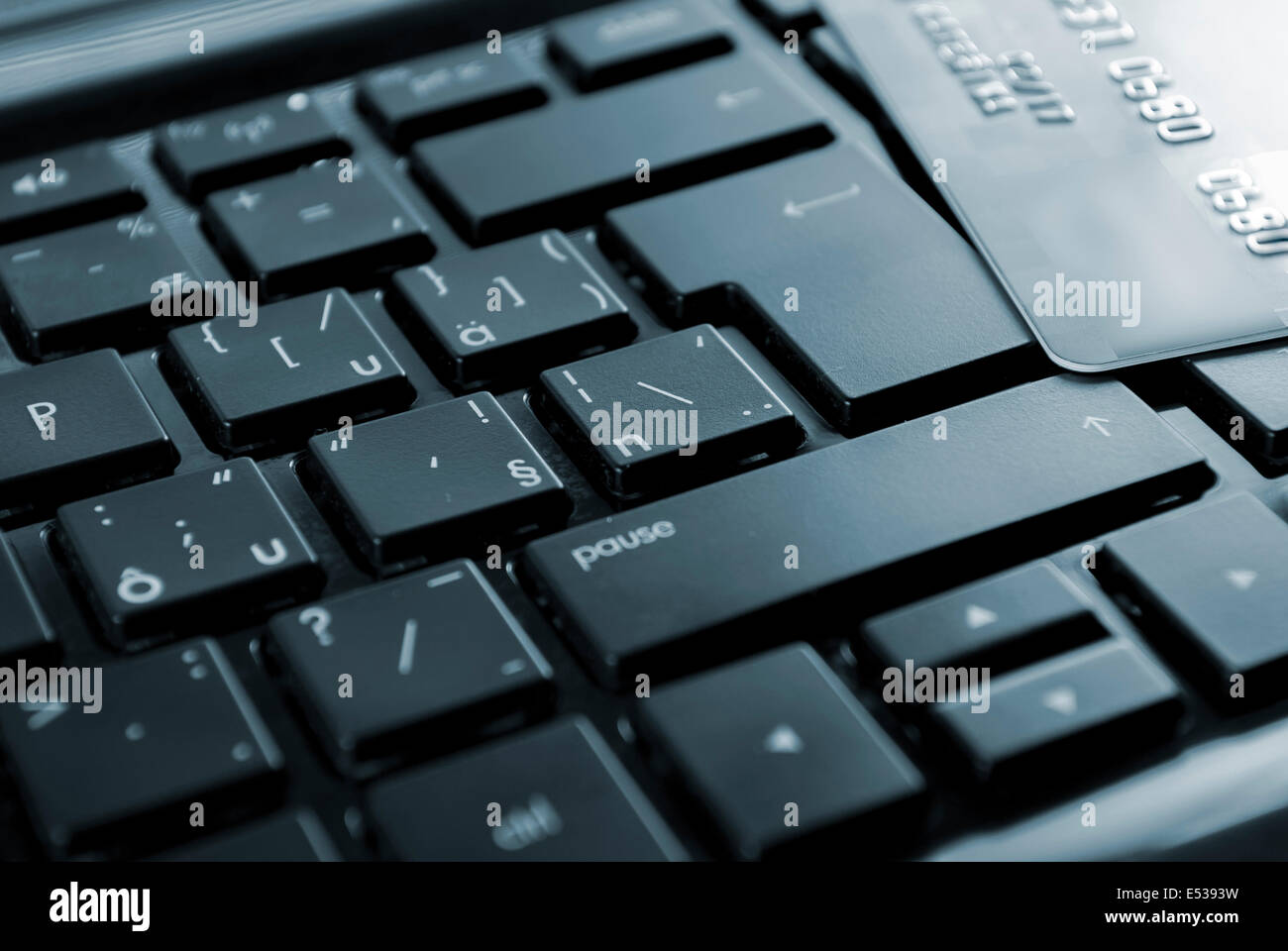 Credit card on keyboard Stock Photo - Alamy