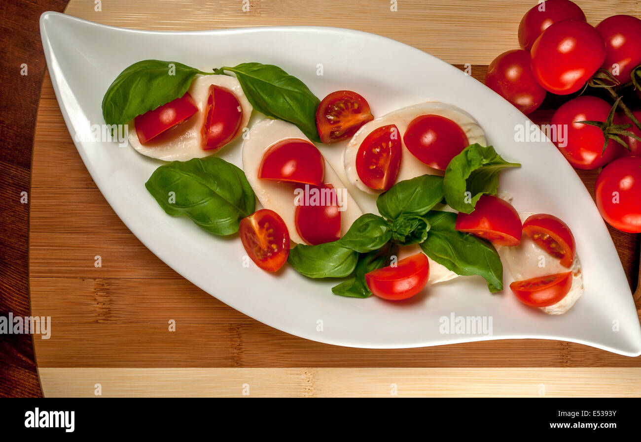 classic caprese salad with tomato and mozzarella and basil Stock Photo ...