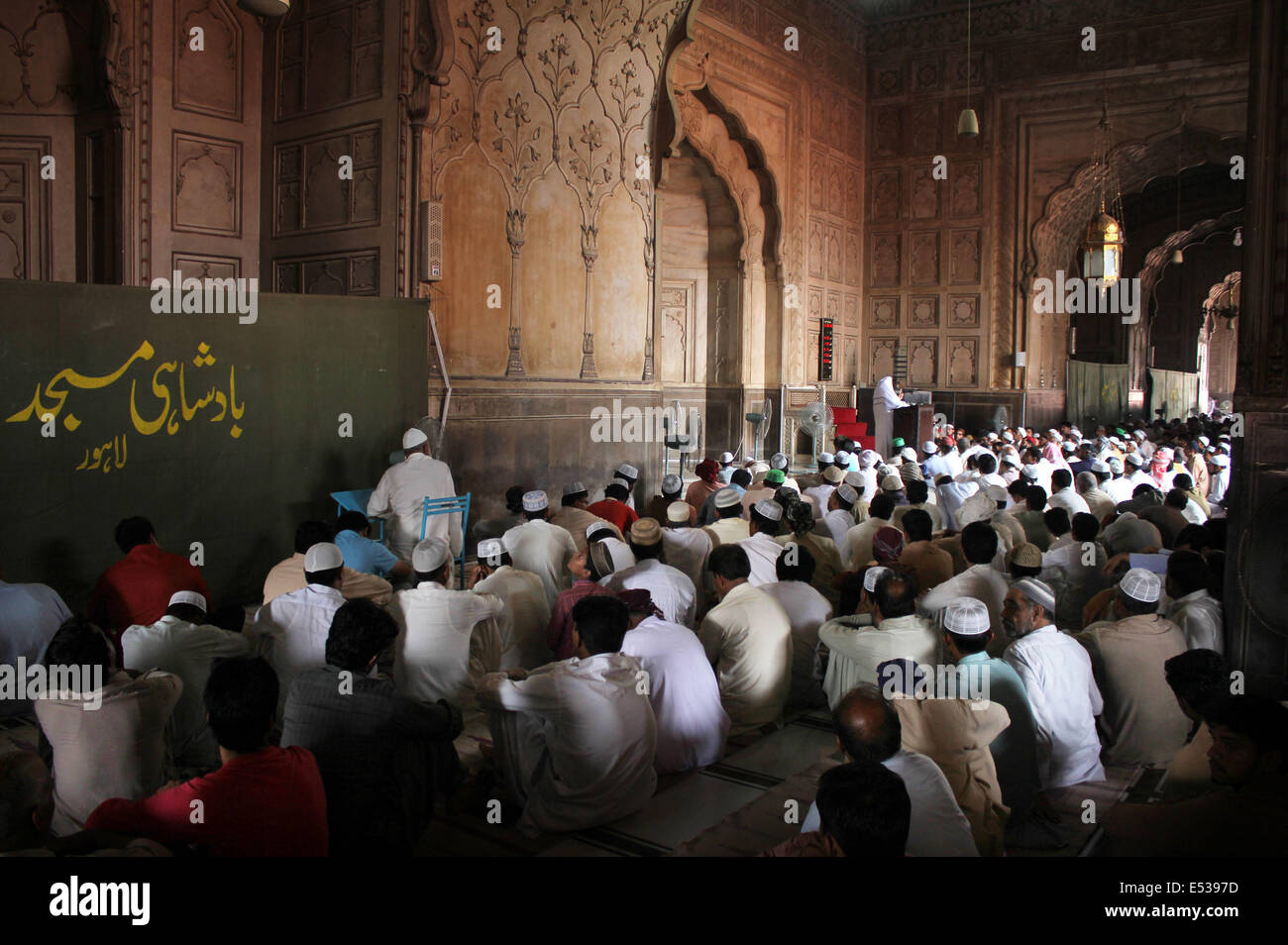 Lahore, Pakistan. 18th July, 2014. The faithful Pakistani Muslims offer ...