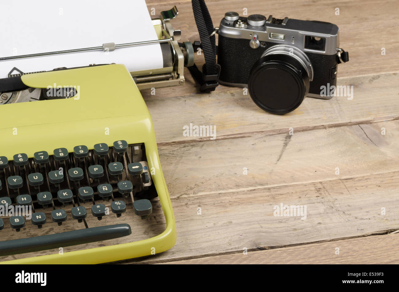 Typewriter and a film camera, classic journalist tools Stock Photo - Alamy