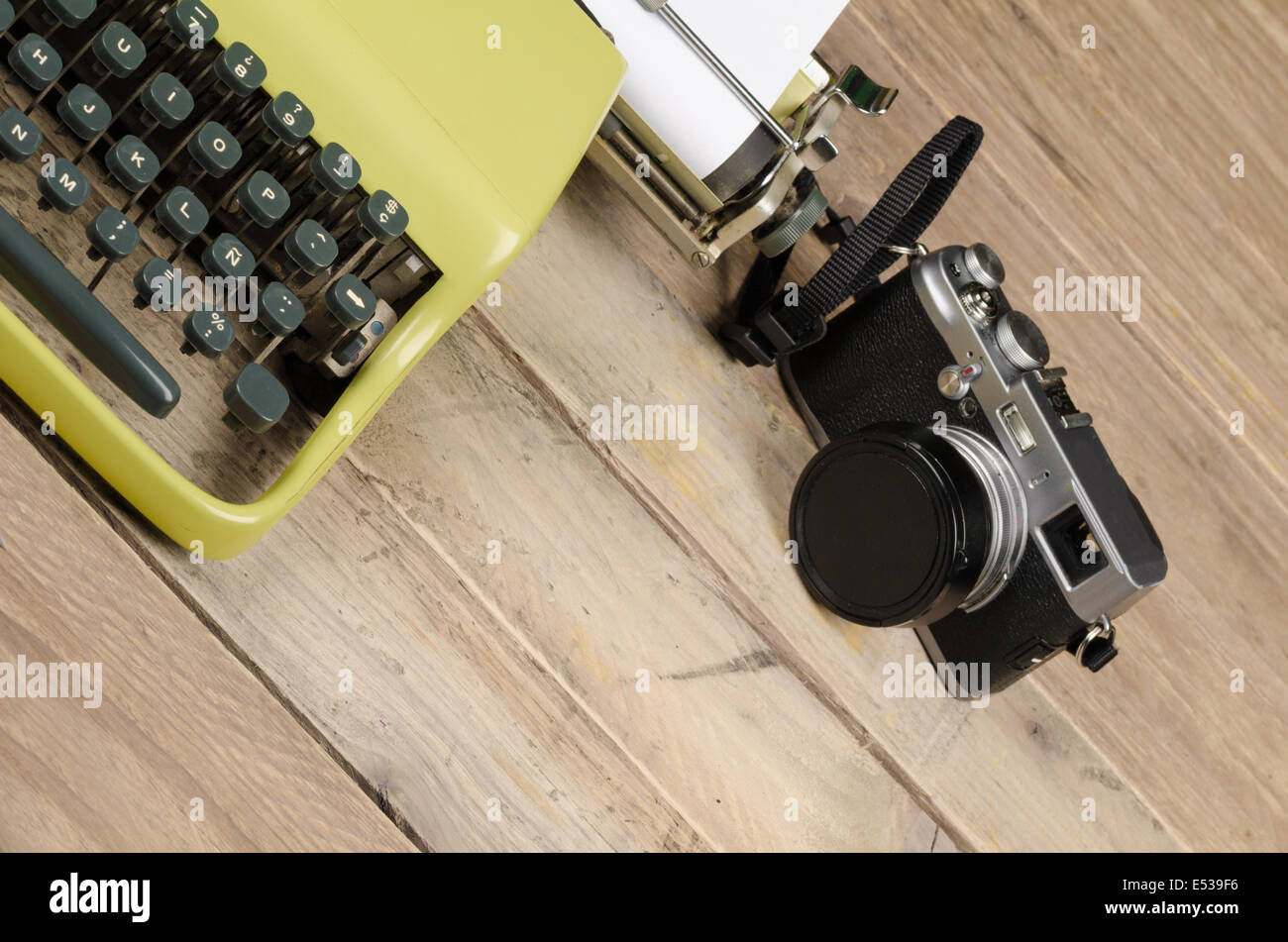 Typewriter and a film camera, classic journalist tools Stock Photo - Alamy