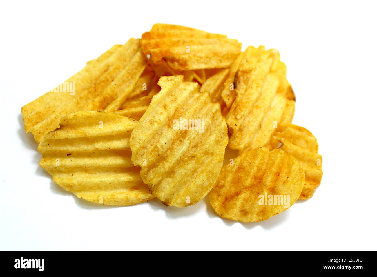 Snack potato chips heaps on a white background Stock Photo - Alamy