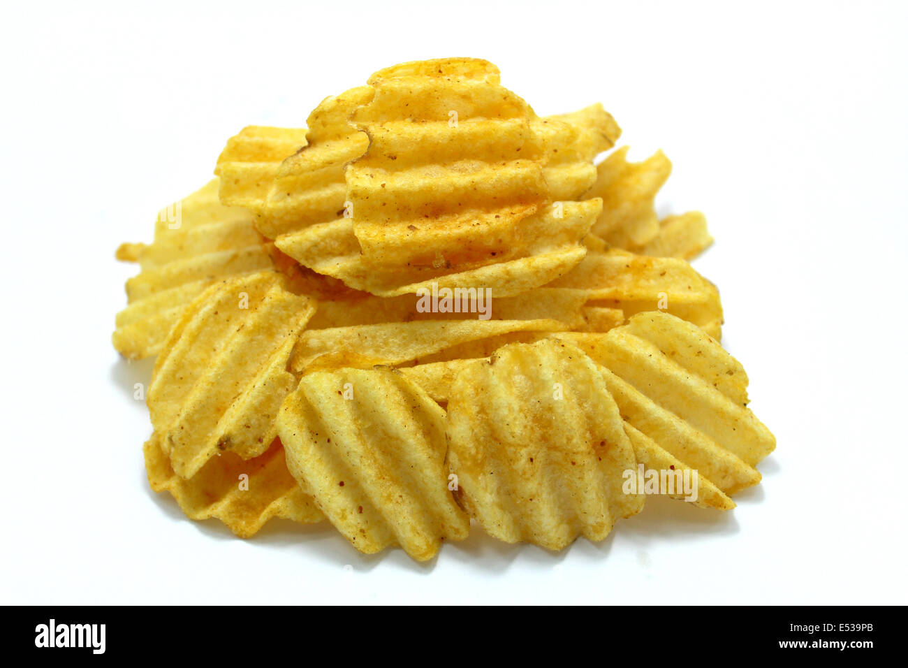 Snack potato chips heaps on a white background Stock Photo - Alamy