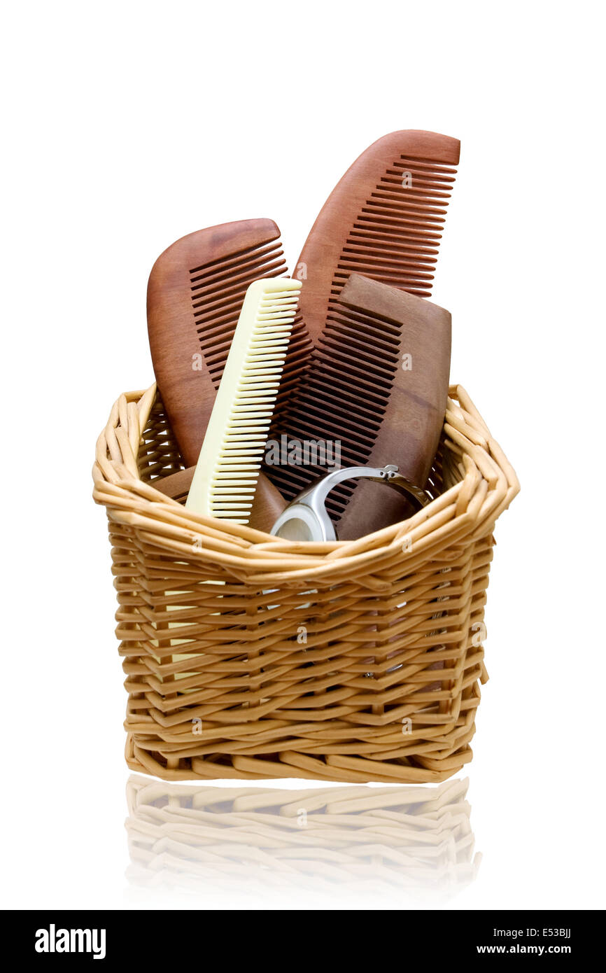 Wooden combs in the Rattan basket isolated on white background Stock ...