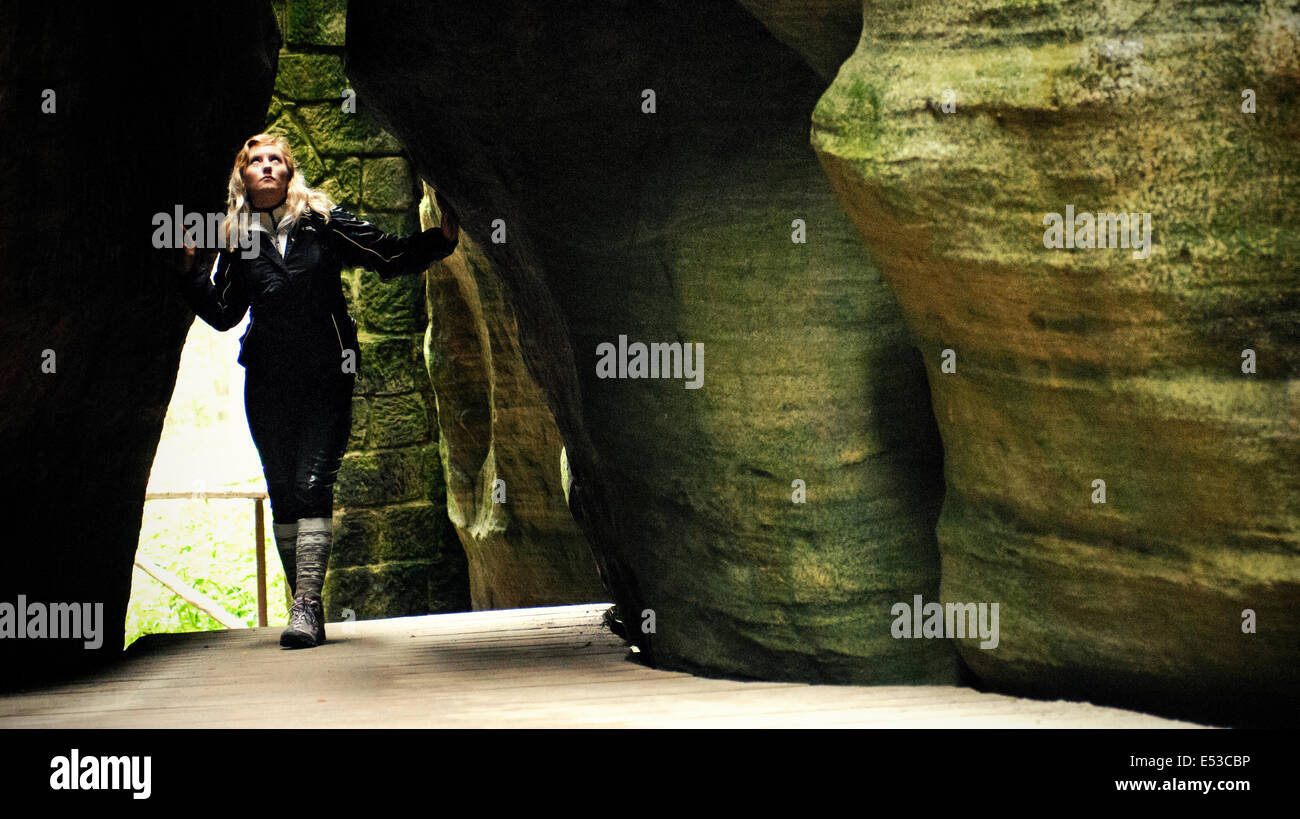Blond girl lost in the labyrinth Stock Photo - Alamy