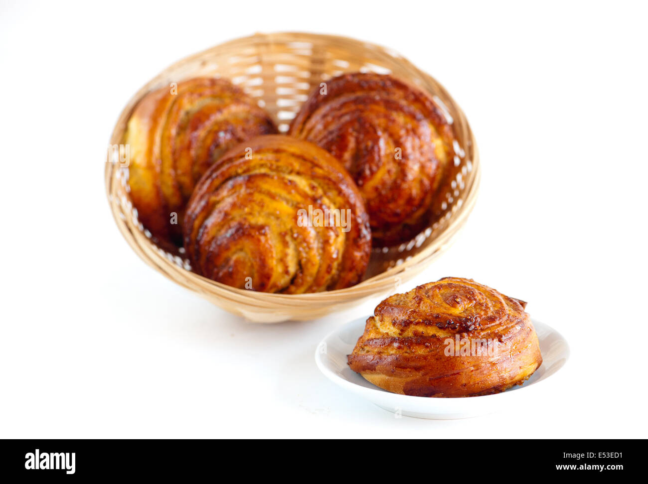 Buns in a basket isolated on white background Stock Photo - Alamy