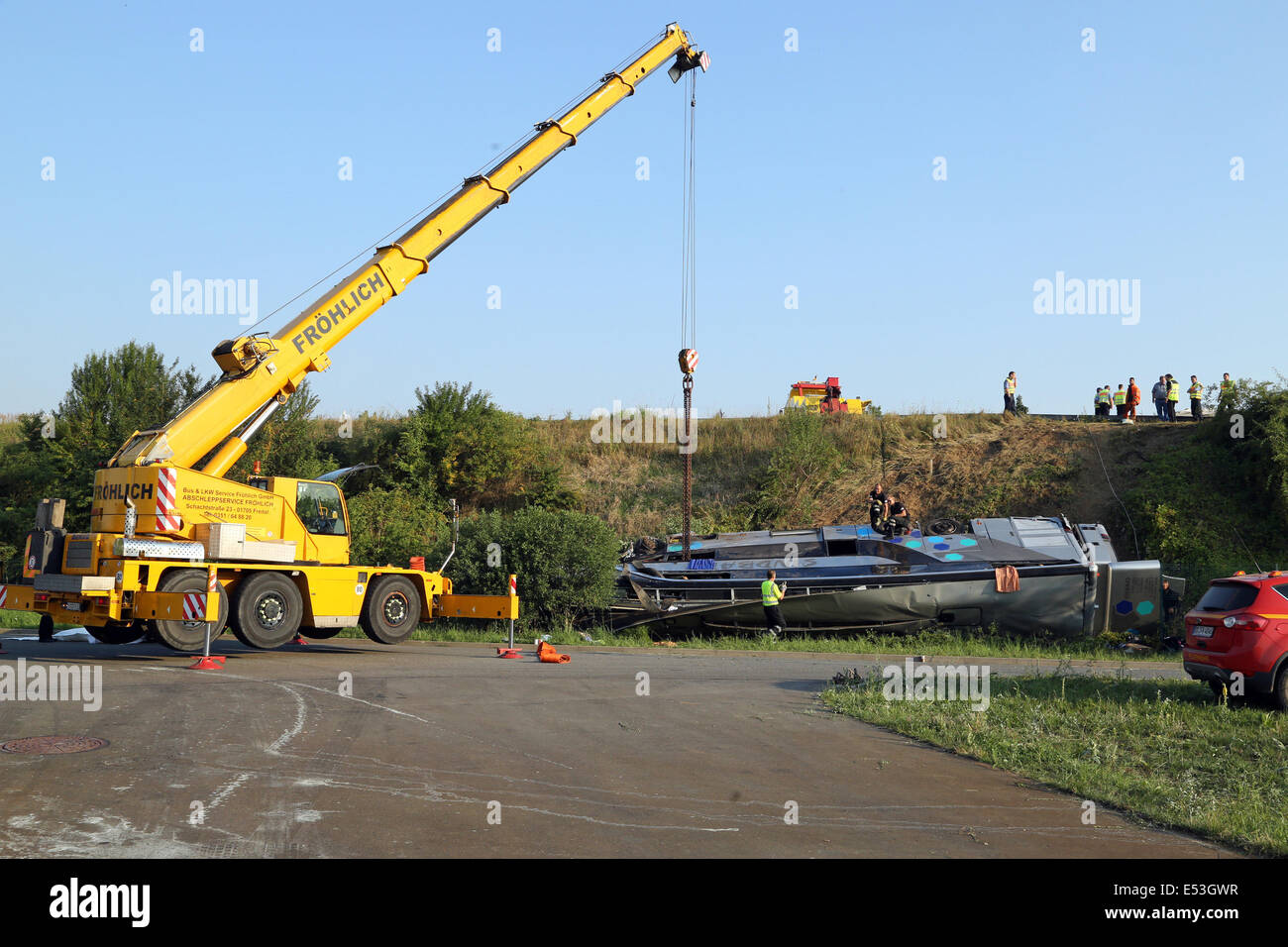 Dresden, Germany. 19th July, 2014. A damaged coach stands on the road ...