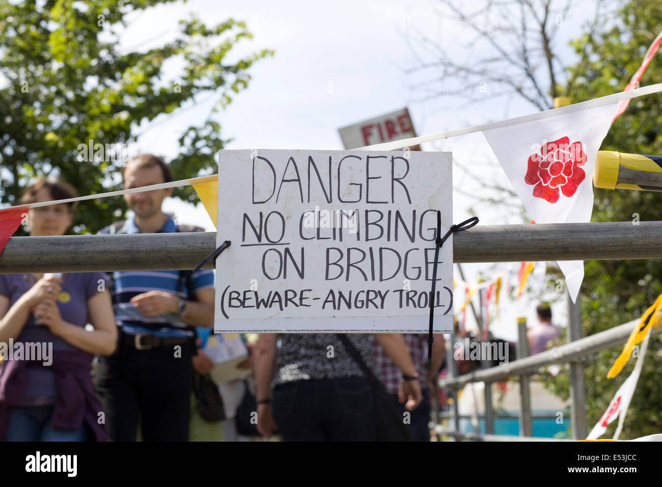 Sign on a wooden bridge "Danger no climbing on the Bridge" Beware of ...