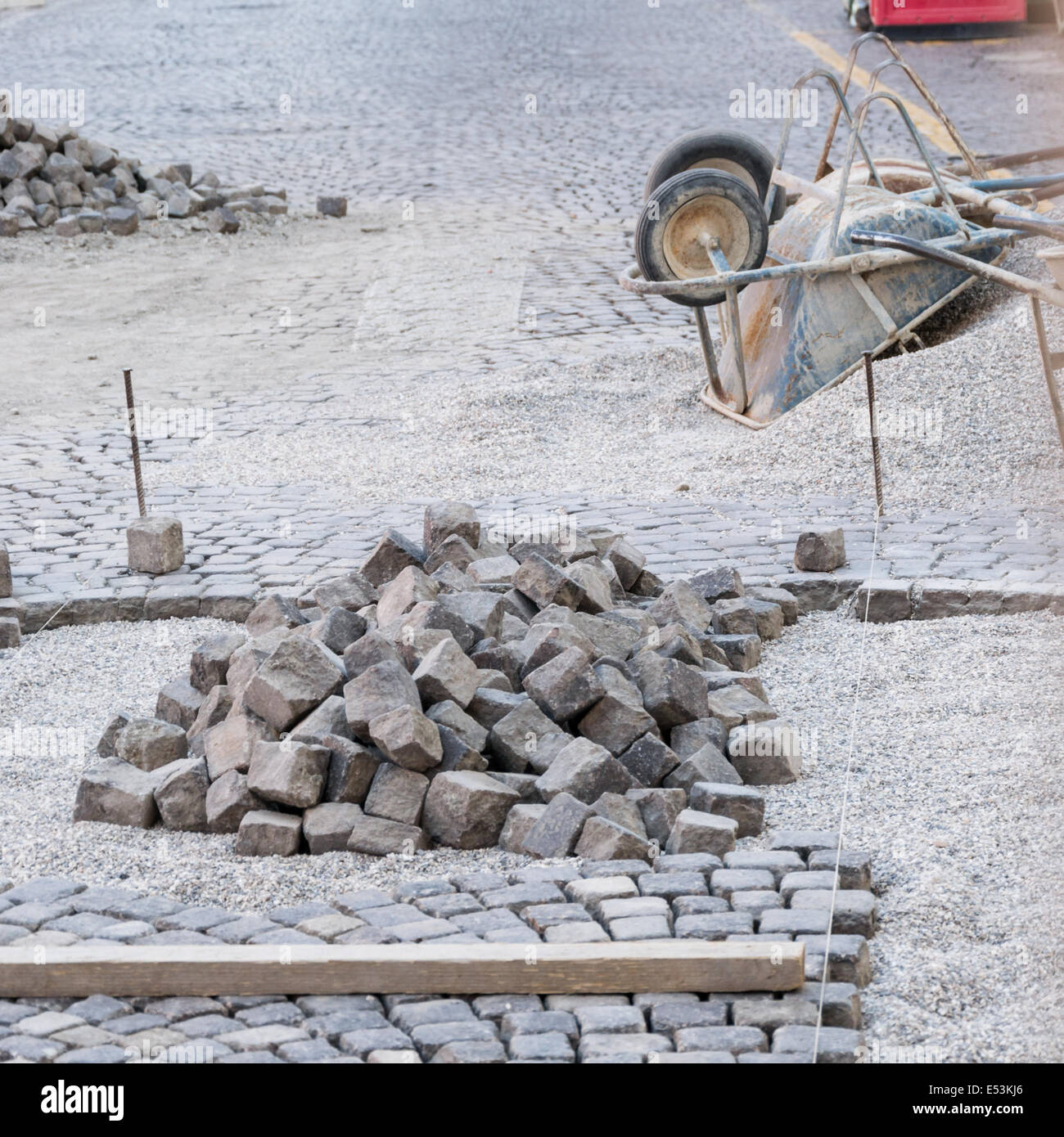 Renovation of an old street made of cubic stones Stock Photo - Alamy