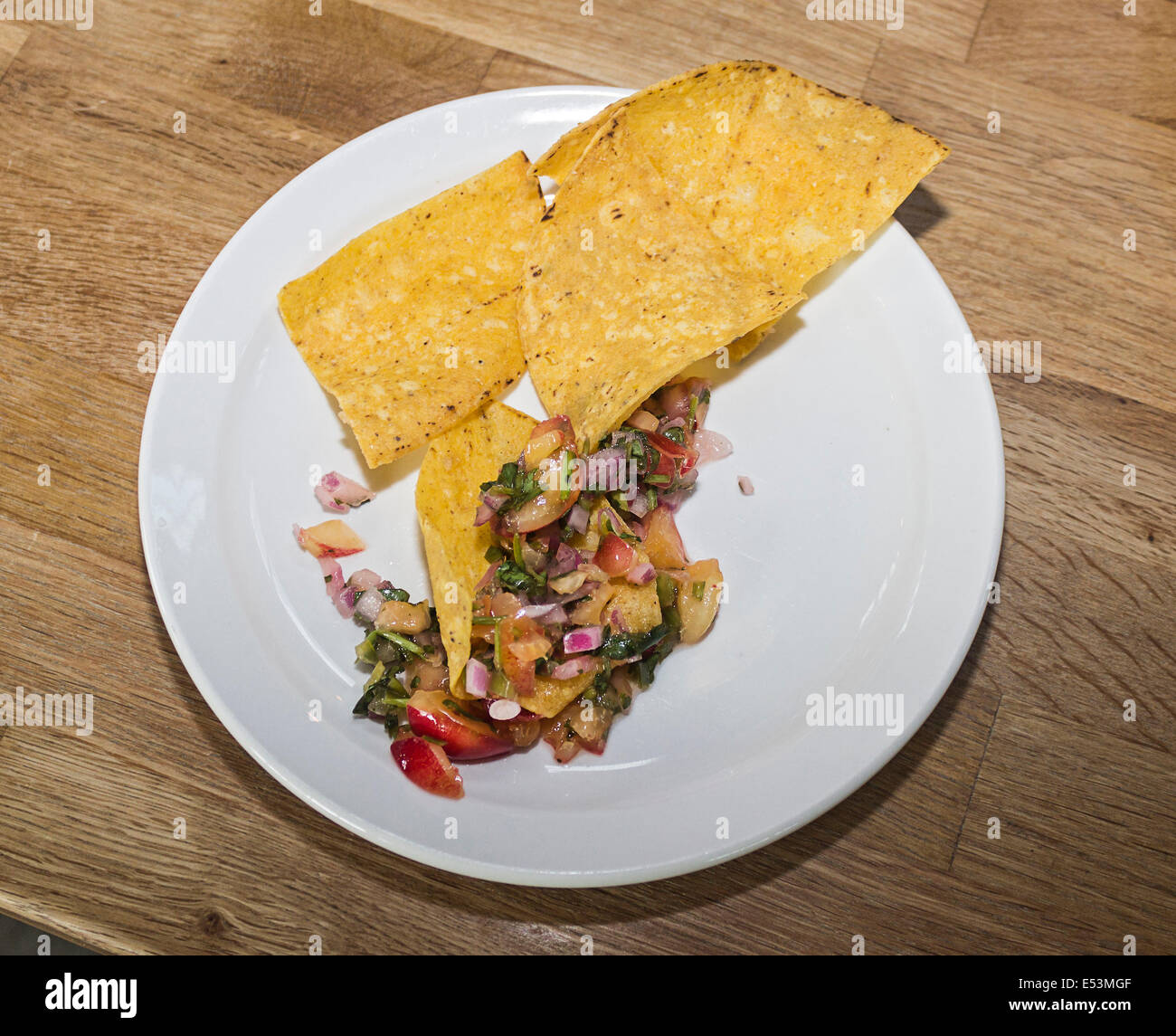 Salsa made with Orondo Ruby cherries and taco chips at South, a Mexican ...